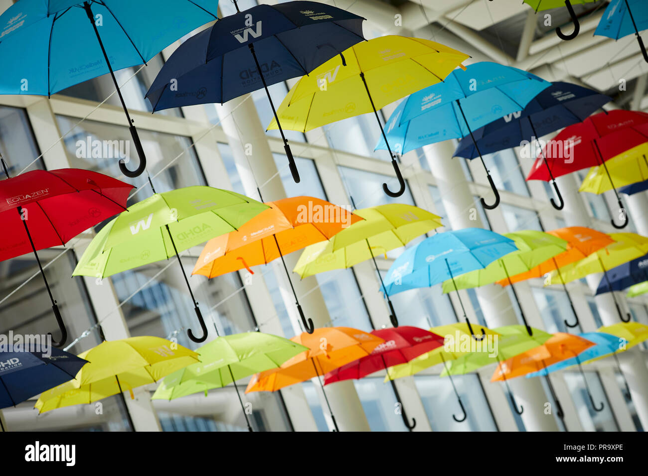 Brightly coloured umbrellas suspended in MediaCityUK Salford Quays to ...