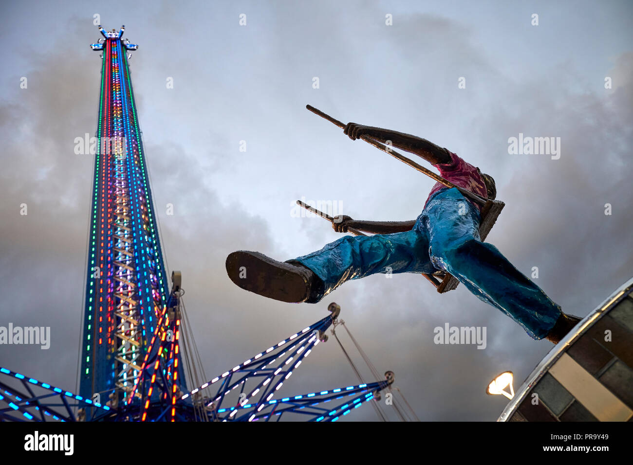 Funfair rides at night fall in orlando Stock Photo - Alamy