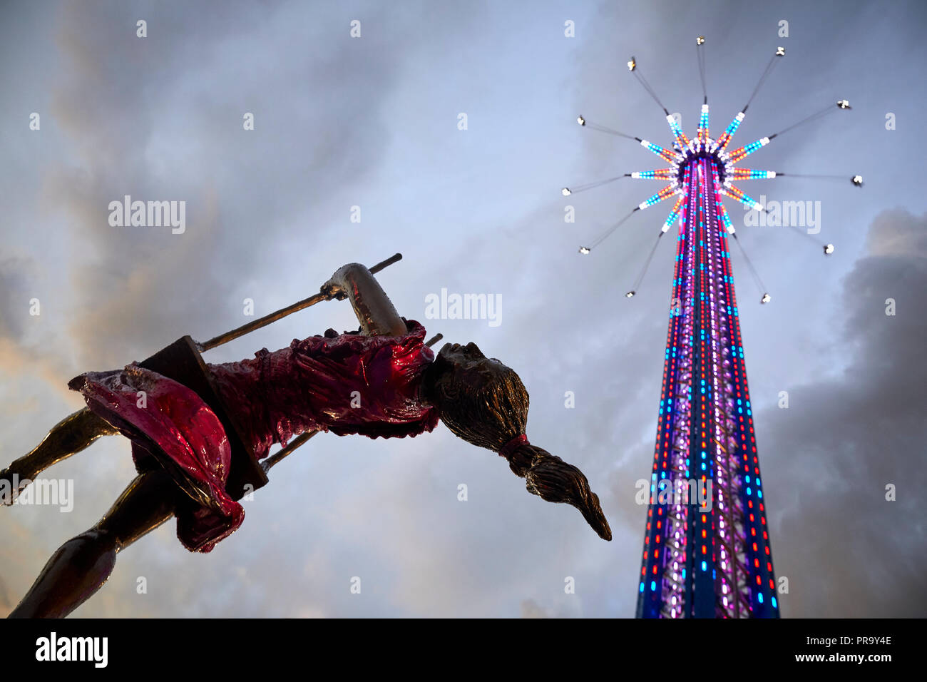 Funfair rides at night fall in orlando Stock Photo - Alamy