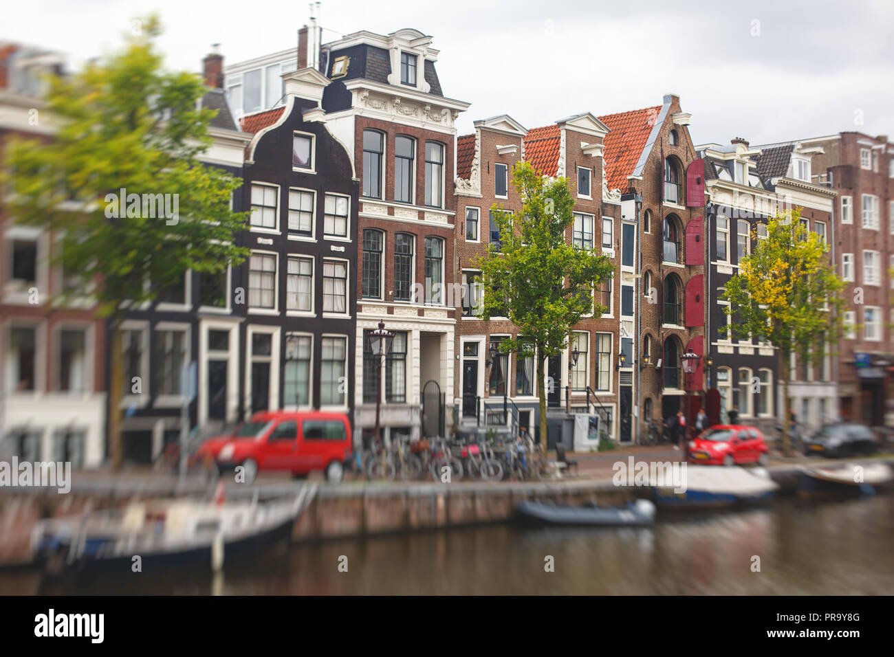 Summer view of the "Dancing Canal Houses of Damrak' , iconic canal ...