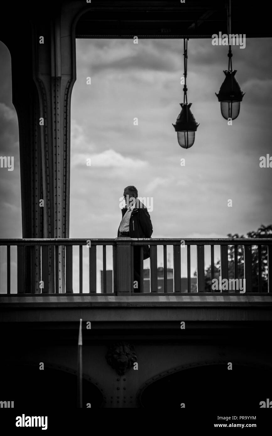 Man and street lamps Stock Photo - Alamy