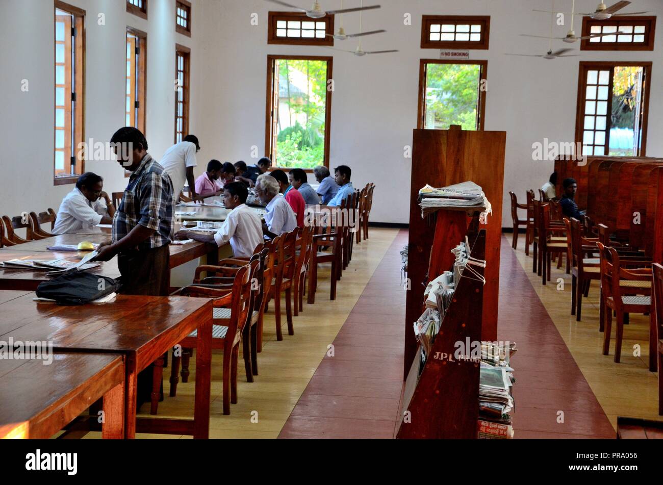 Men read journals newspapers in male reading room Jaffna Public Library ...
