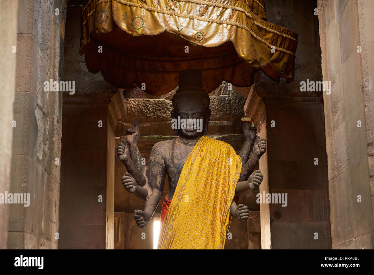 Statue of eight-armed Buddhist deity Marichi in Angkor Wat. The Angkor ...