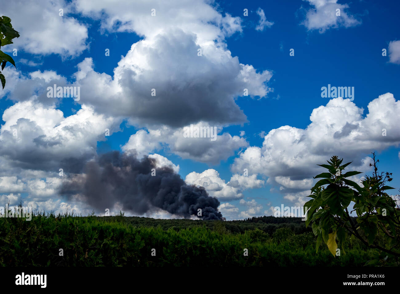 Huge black smoke of a giant fire from burning truck transporting ...