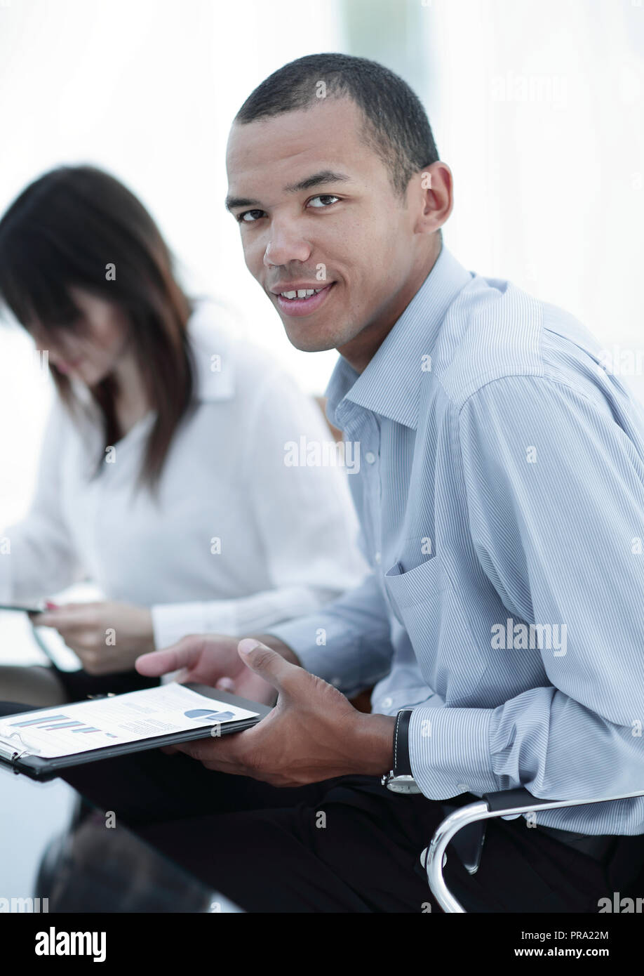 successful young business men with financial document Stock Photo - Alamy