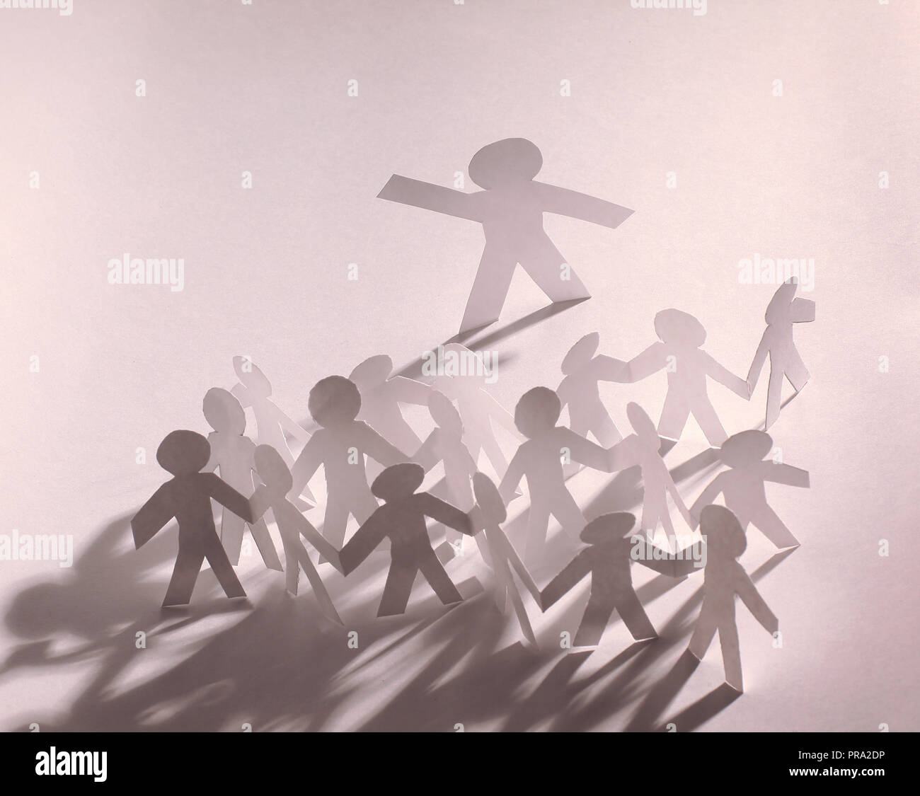 concept of leadership.group of paper men paper background Stock Photo ...