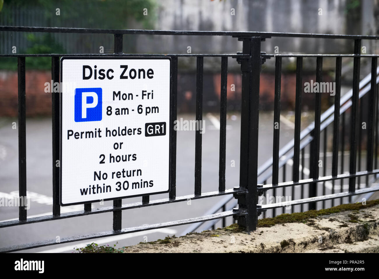 Disabled Badge Holders Disc Zone Only at Car Park Sign Stock Photo - Alamy
