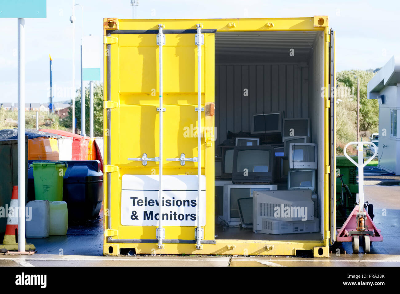Old television tv monitors pc computer screens at refuse dump skip ...