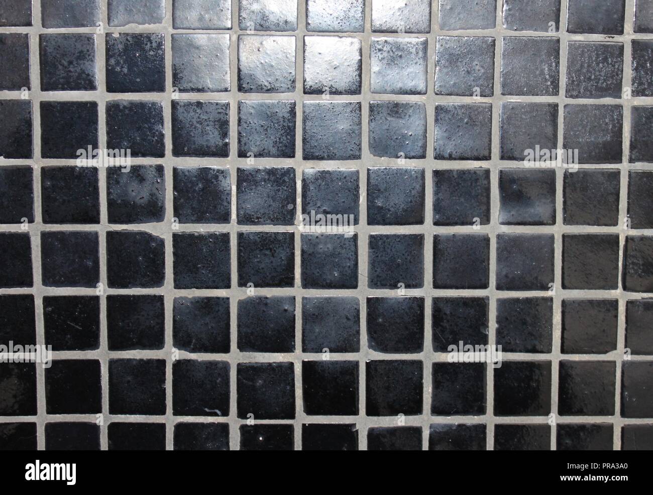 Black tiles on wall hi-res stock photography and images - Alamy
