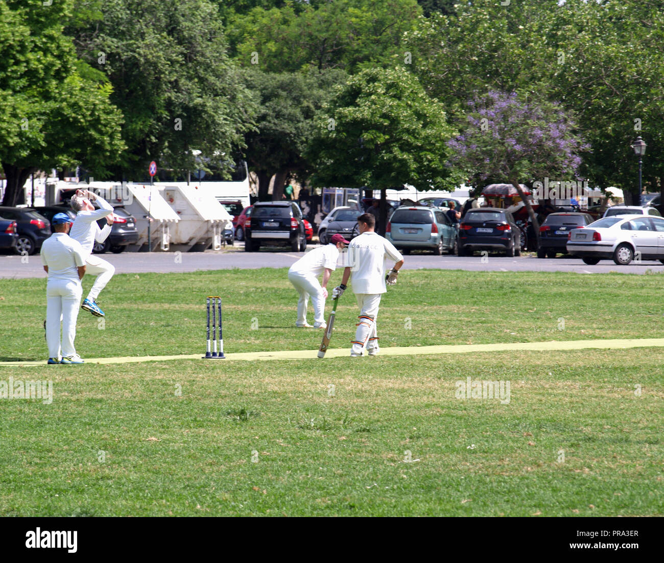 Cricket match in progress at The Liston, Corfu Town, Kerkyra, Greece ...