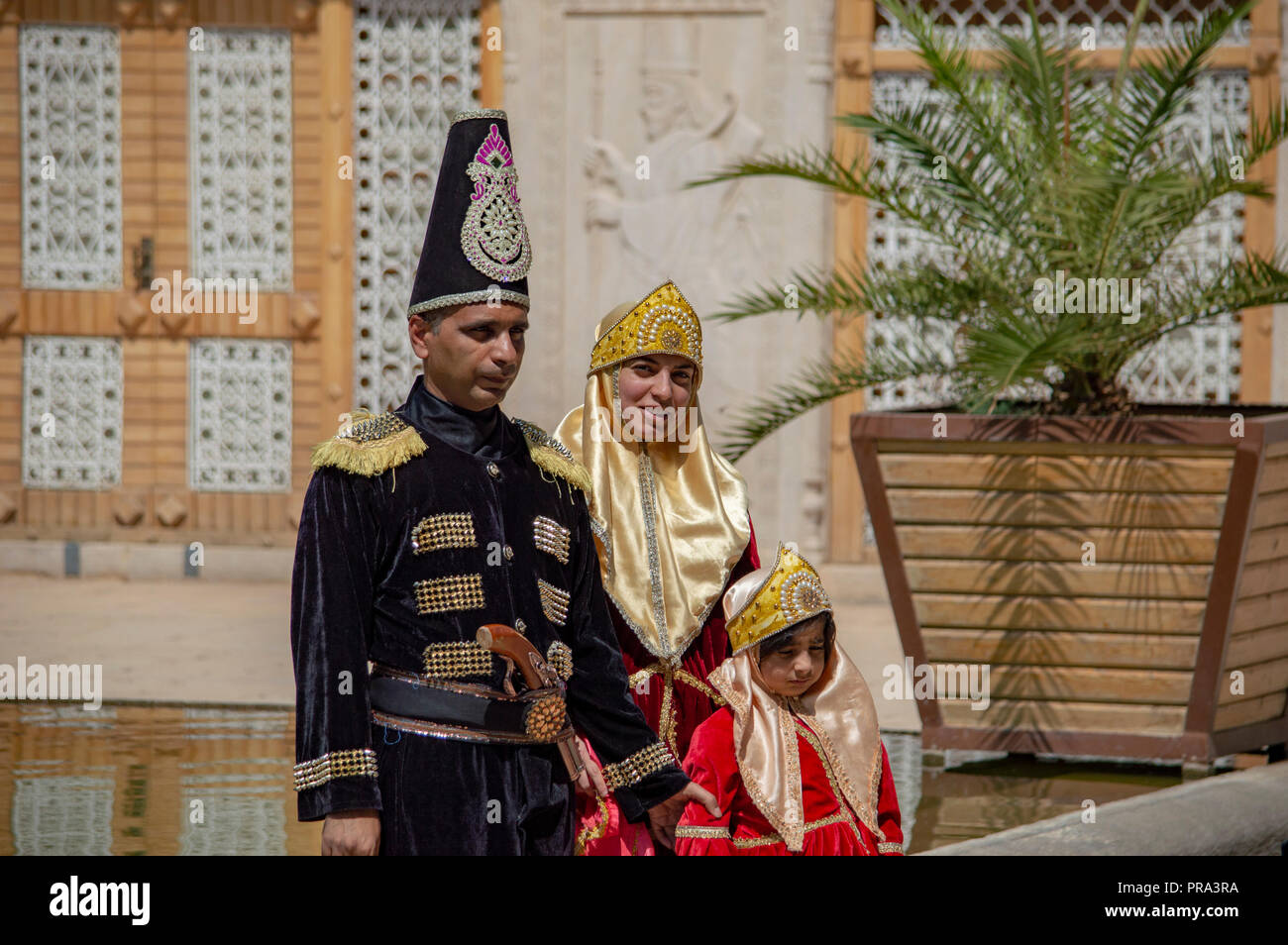 A family dressed in traditional Shirazi clothing at Afif Abad Garden in ...