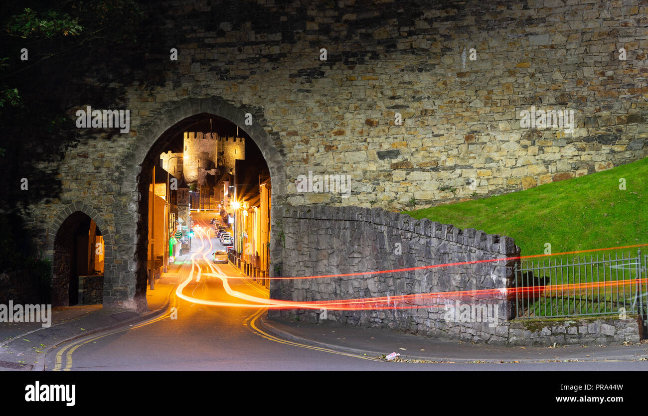 Conwy Castle viewed through an arch in the Town walls. Image taken in ...