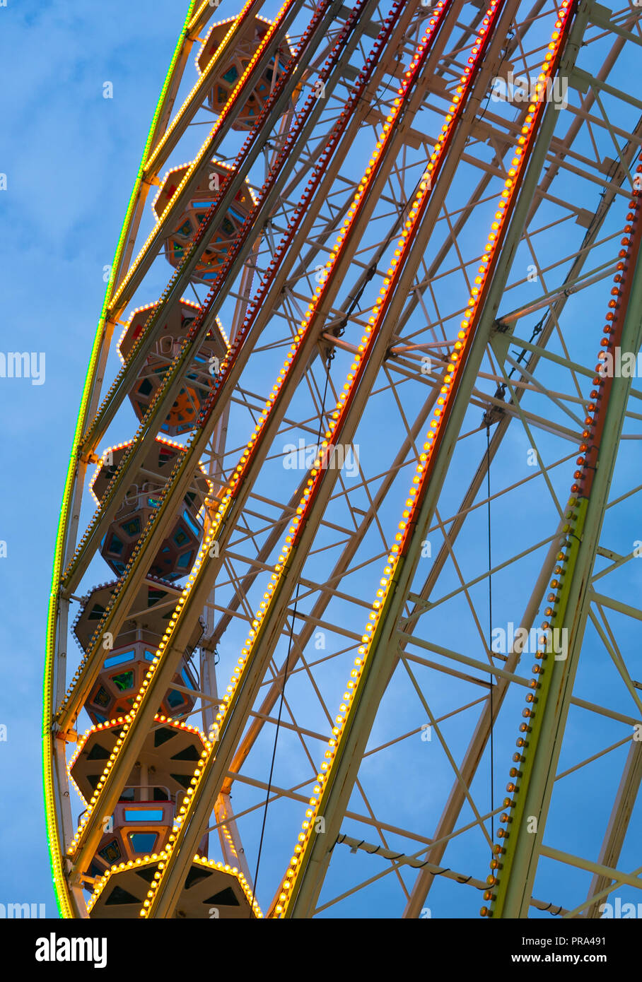 Fun colorful ferris wheel ride at carnival fair Stock Photo - Alamy