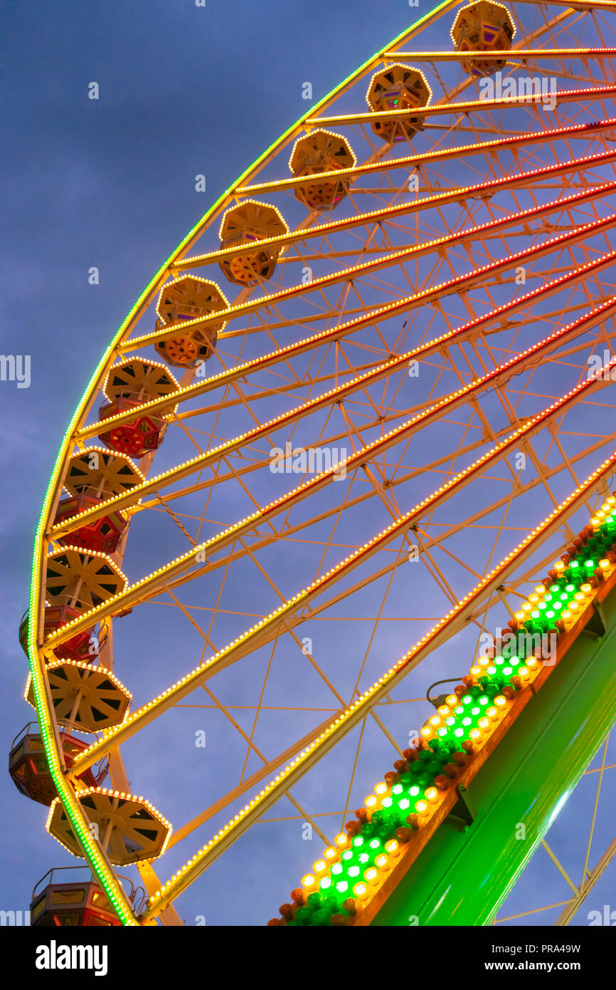 Colorful ferris wheel at carnival fair from below Stock Photo - Alamy