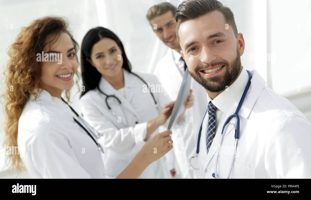 Portrait of aged male doctor teaching medical students Stock Photo - Alamy