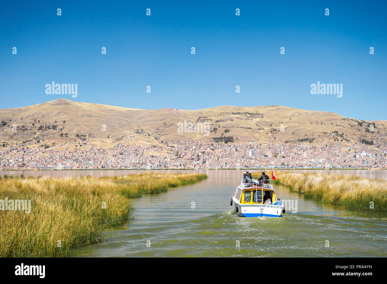 A boat is heading to the Puno Port - Peru Stock Photo - Alamy