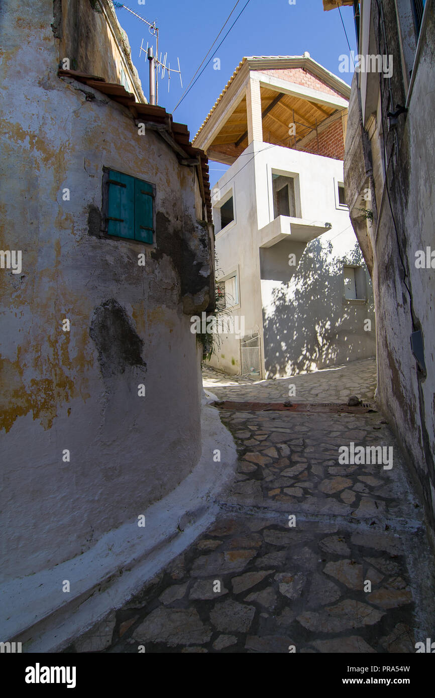 Greek street with blooming flowers Stock Photo - Alamy