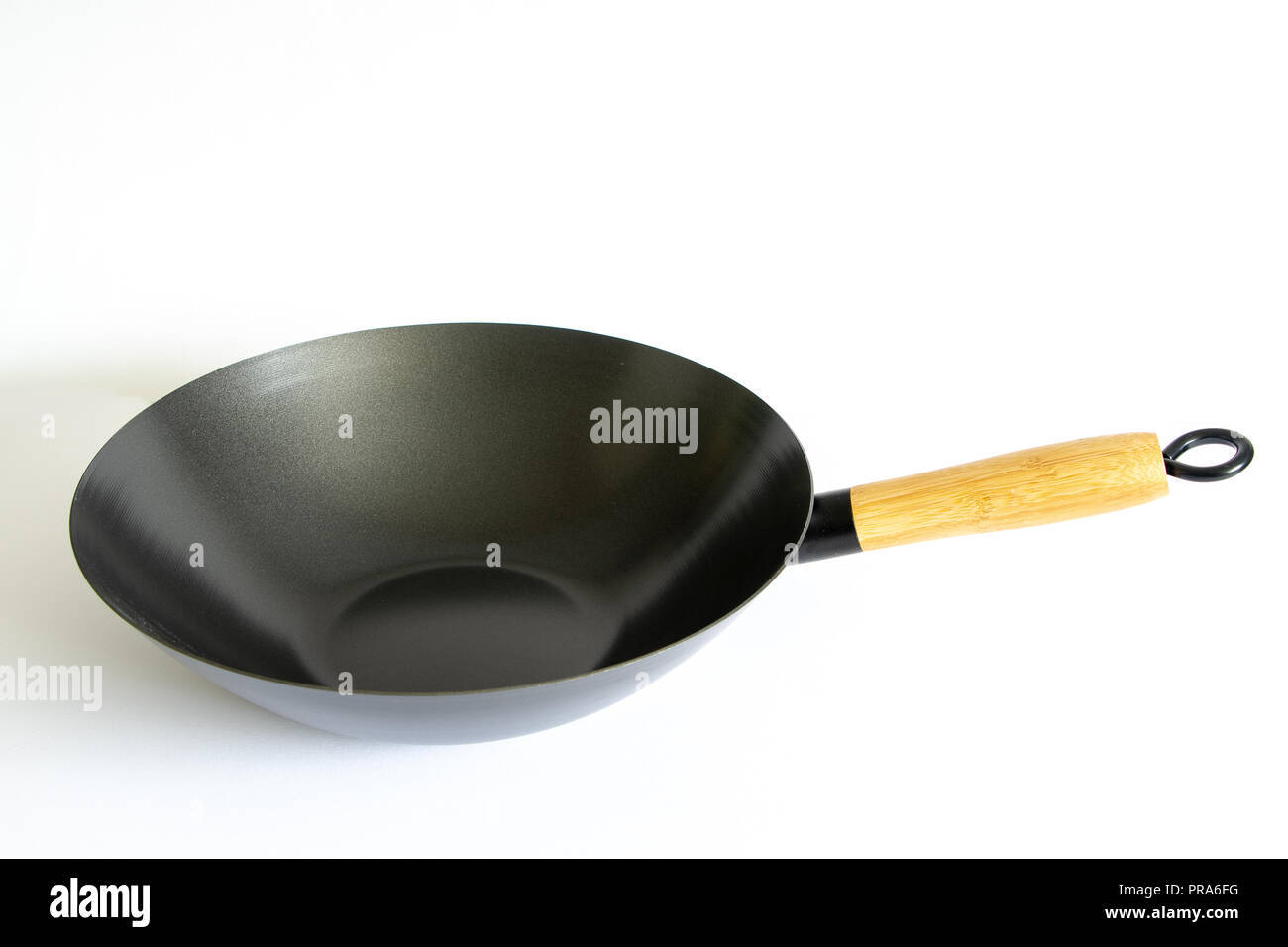 Chinese wok frying pan with wooden handle on a white background Stock ...