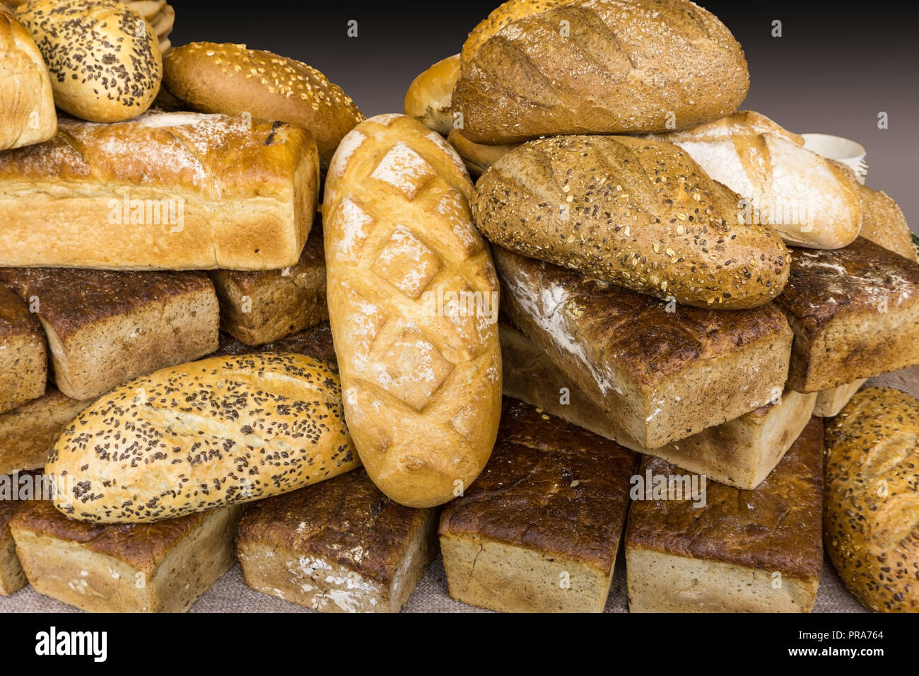 Stack of traditional bread on the street market. Assortment of baked ...