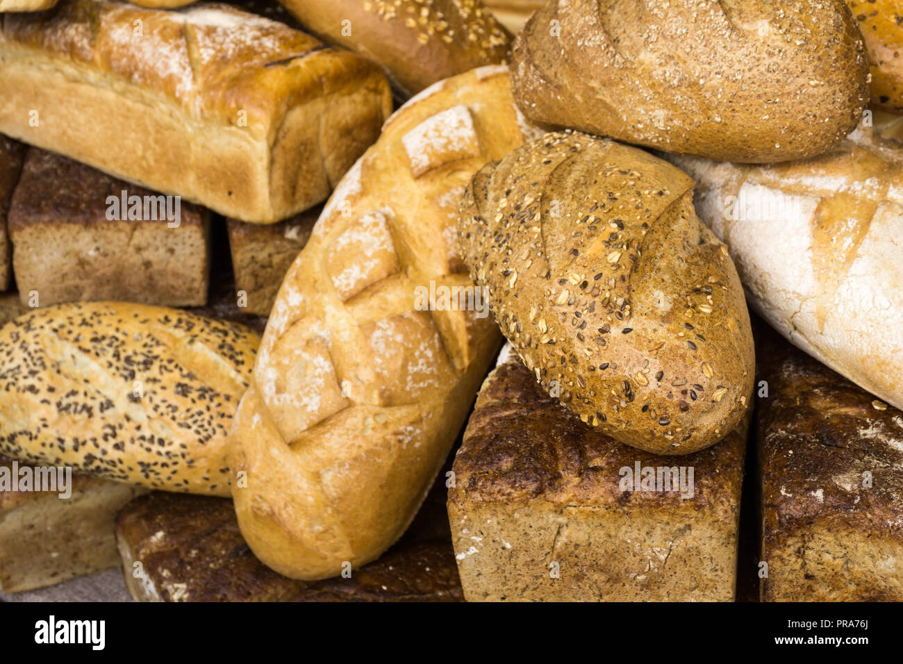 Stack of traditional bread on the street market. Assortment of baked ...