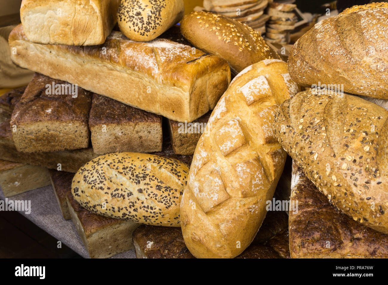 Stack of traditional bread on the street market. Assortment of baked ...