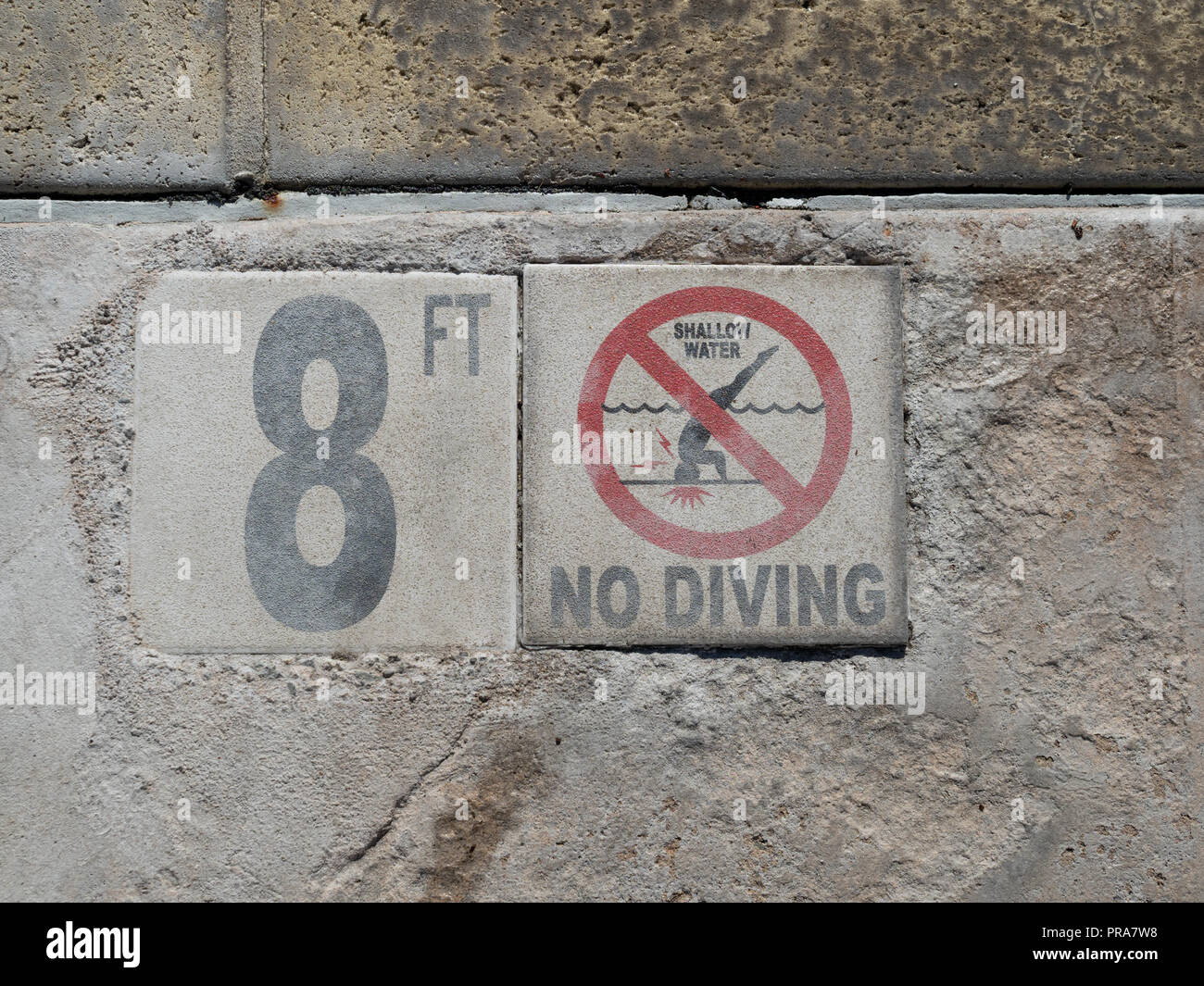 8 feet, shallow water, no diving sign at foot of pool Stock Photo - Alamy