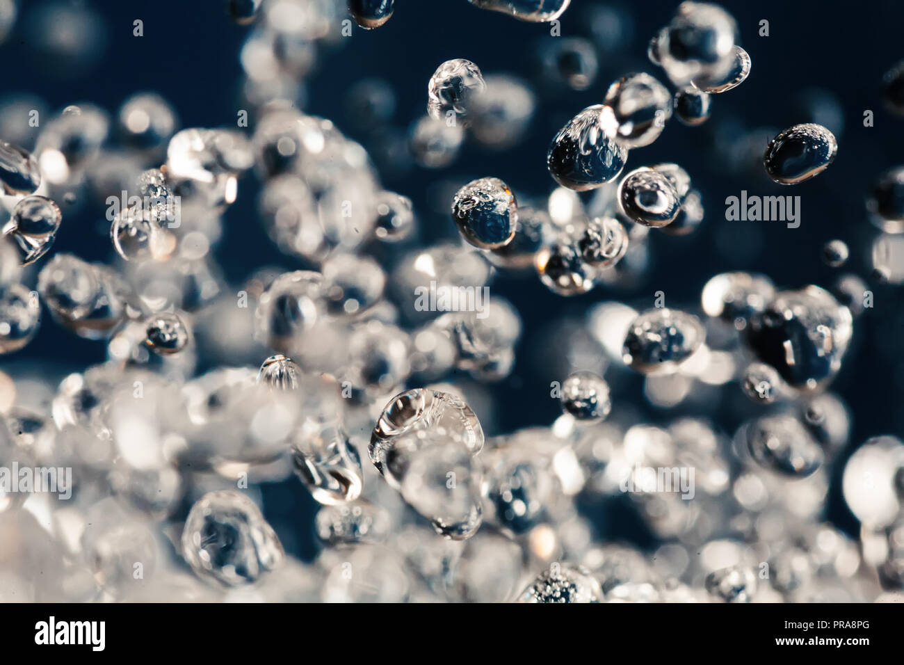 Blue water drops levitation background hi-res stock photography and ...