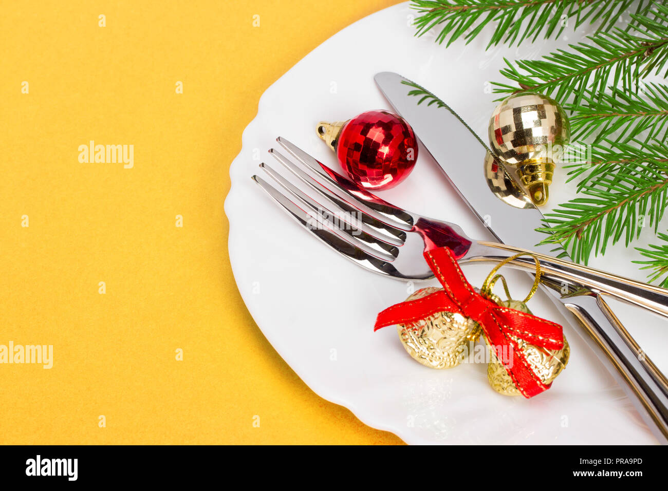 Christmas plate on a yellow background Stock Photo - Alamy