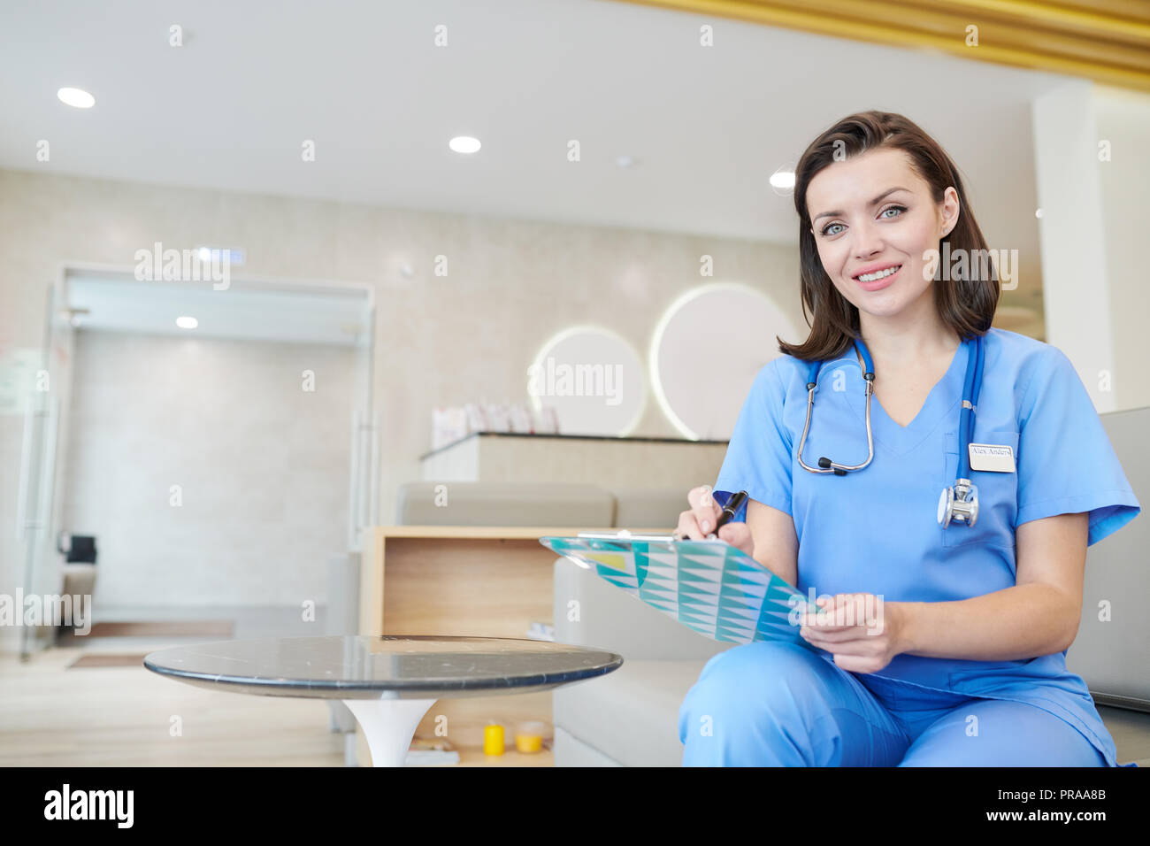 Nurse Posing in Clinic Stock Photo - Alamy