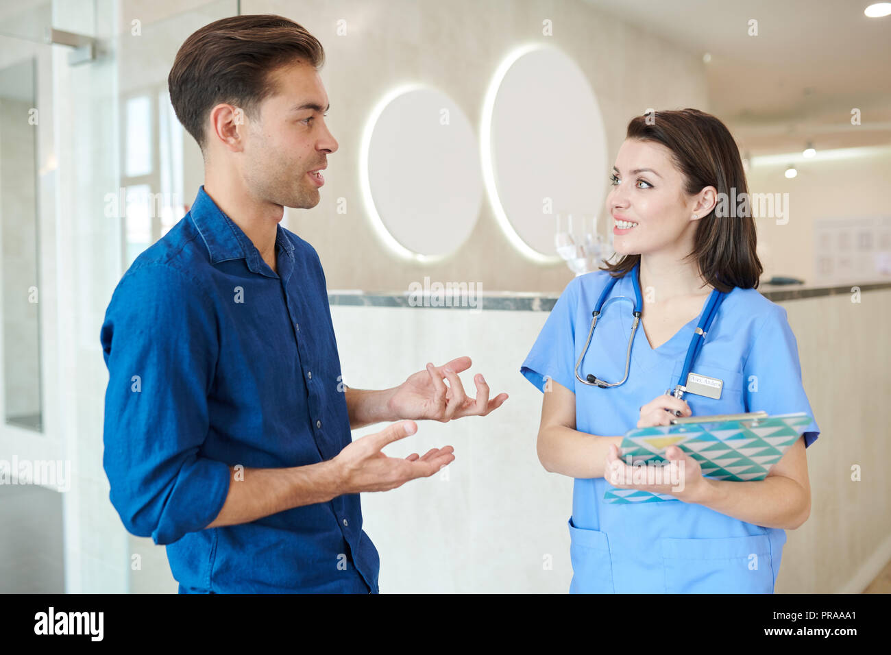 Man Entering Modern Clinic Stock Photo - Alamy
