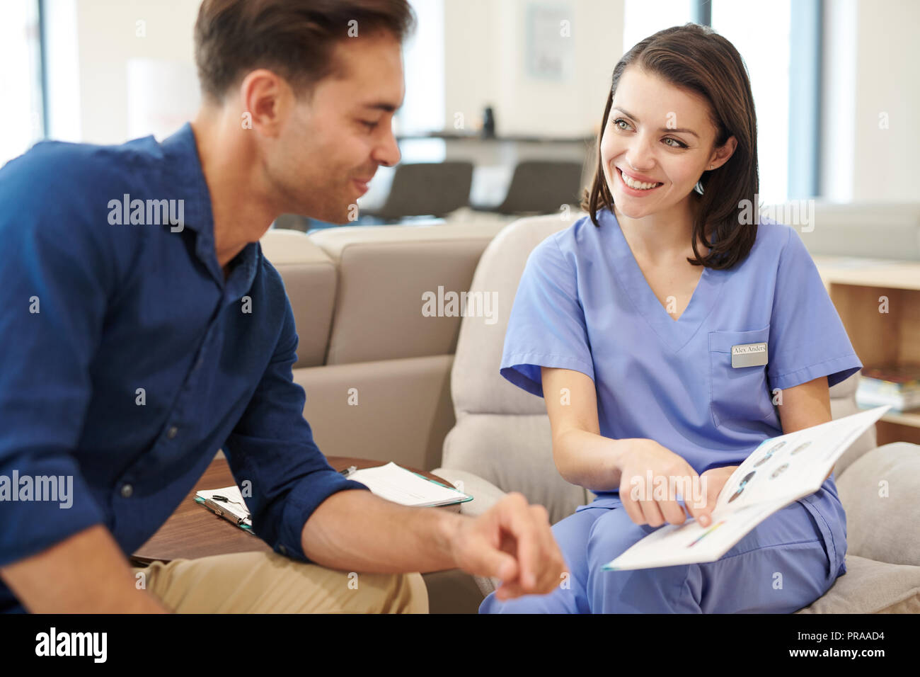 Nurse Talking to Patient Stock Photo - Alamy