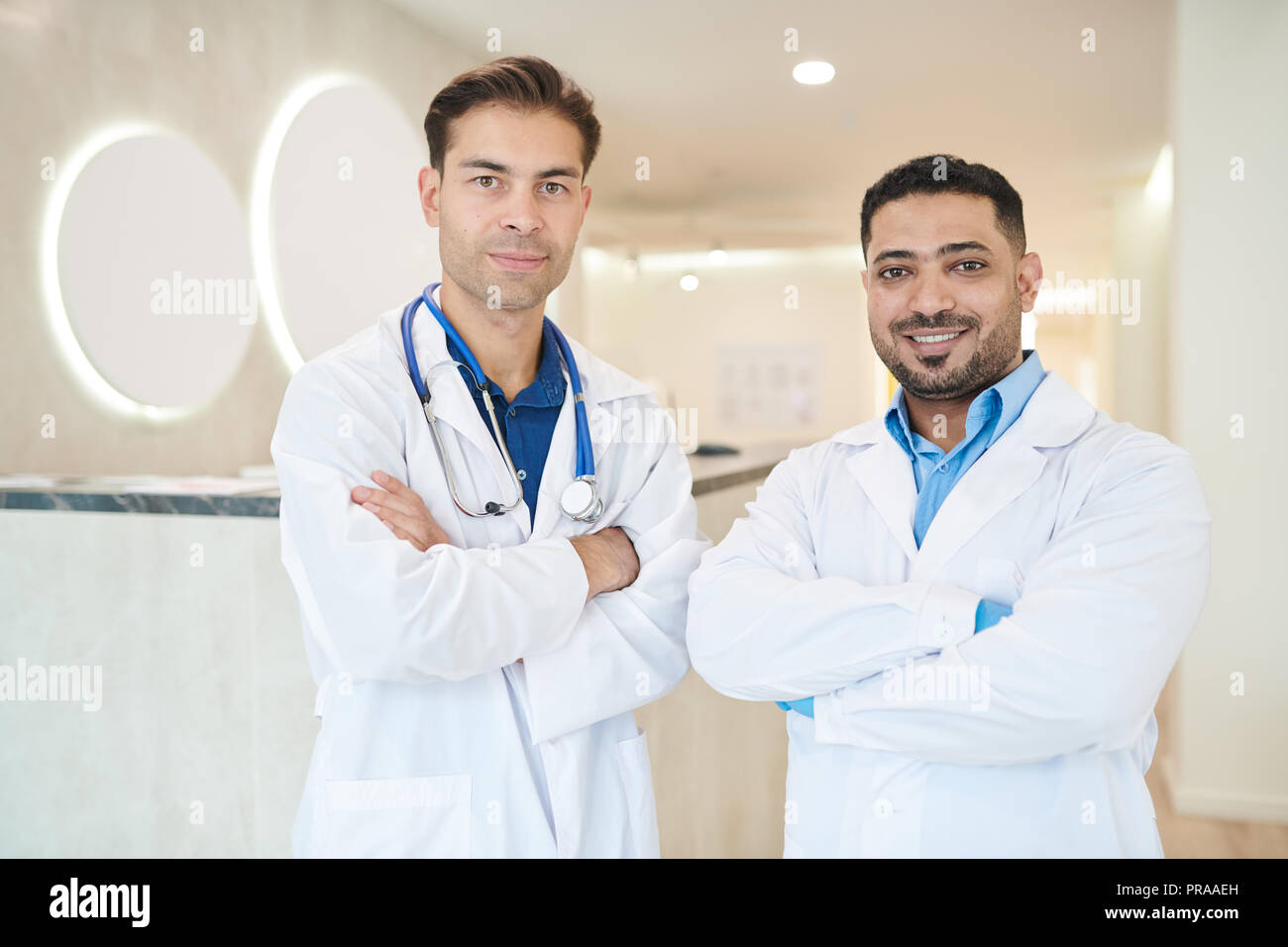 Two Doctors Posing in Clinic Stock Photo - Alamy