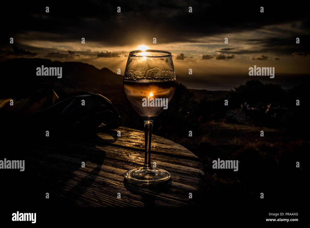 A glass of beer in the sunset Stock Photo - Alamy