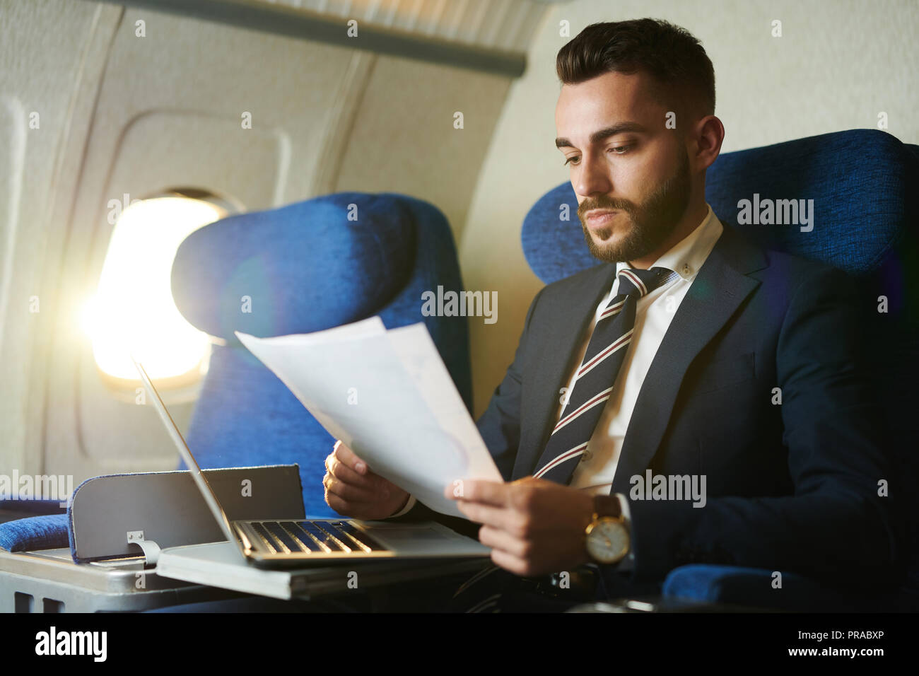 Handsome Businessman Working in Plane Stock Photo - Alamy