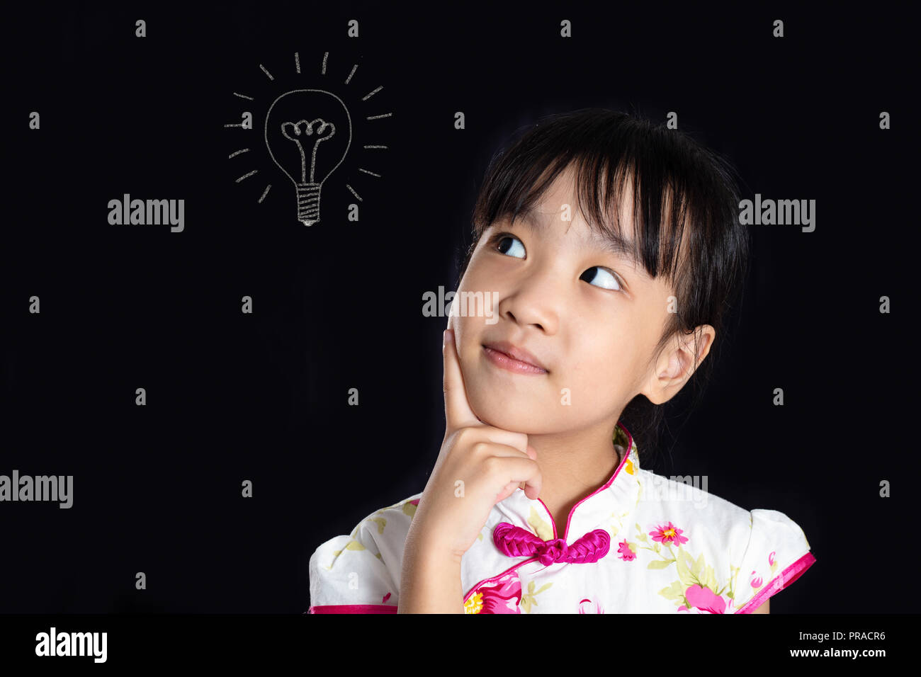 Asian Chinese little girl thinking with bulb sketch in isolated black ...