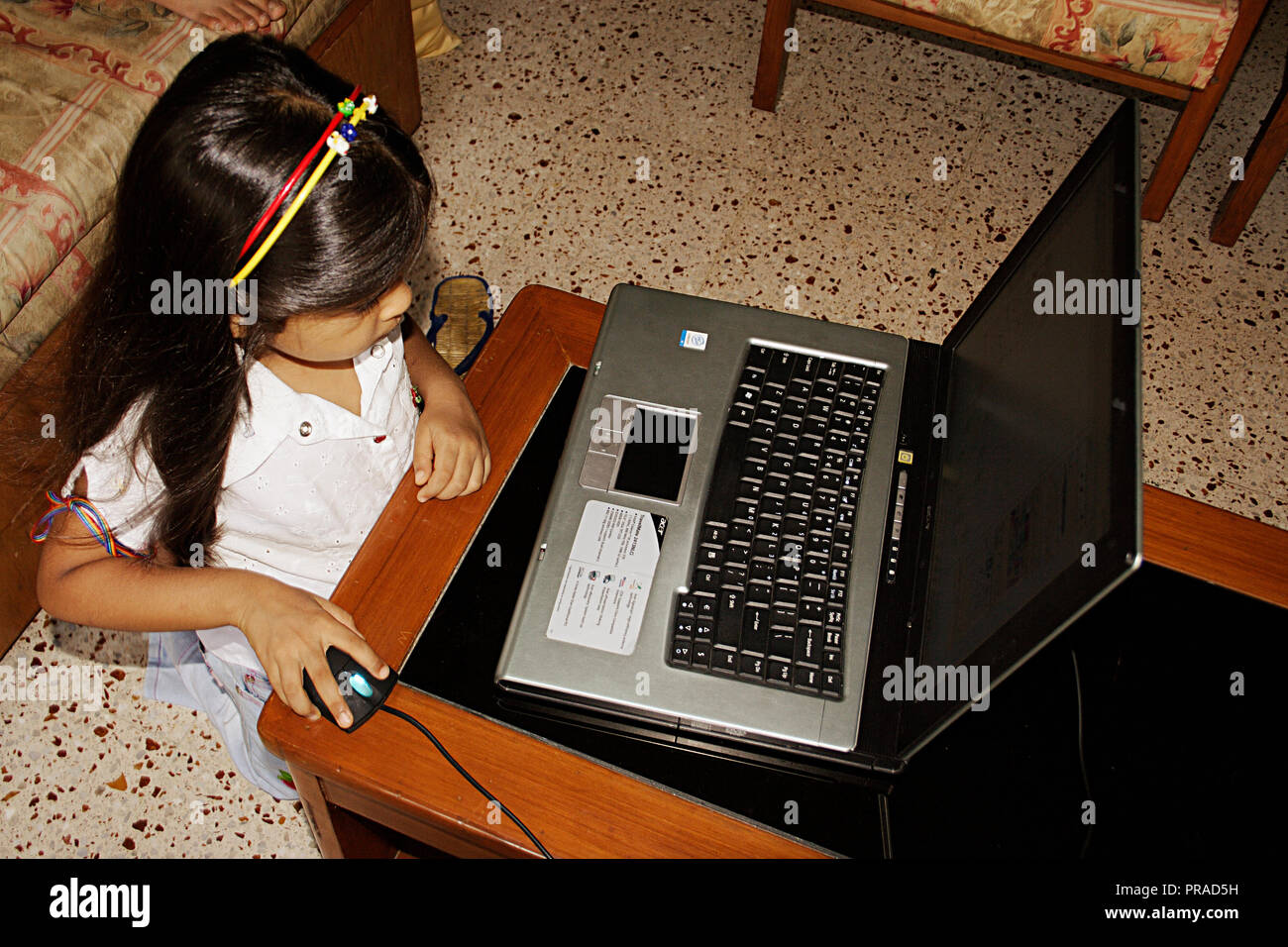 YOUNG GIRL WORKING ON A LAPTOP COMPUTER. IN HER HOME Stock Photo - Alamy