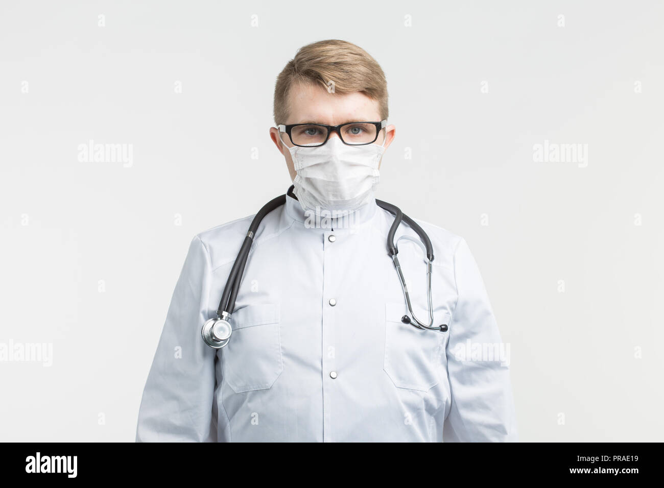 Health and medicine - doctor wearing the stethoscope and white mask on ...