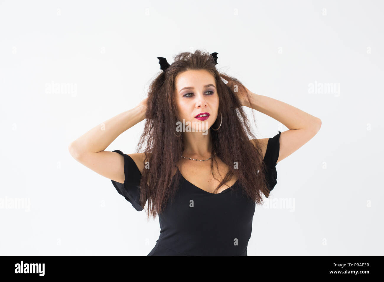 Halloween concept - Happy witch posing over white background Stock ...