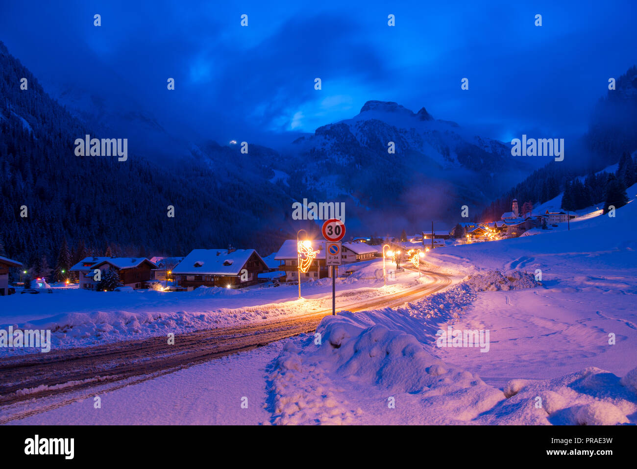 mountain village in alps at night in winte with fresh snow Stock Photo ...