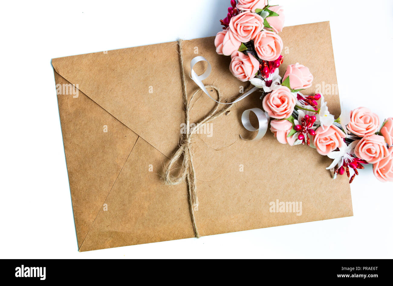 Letter envelope and flower arrangement on white isolated Stock Photo ...