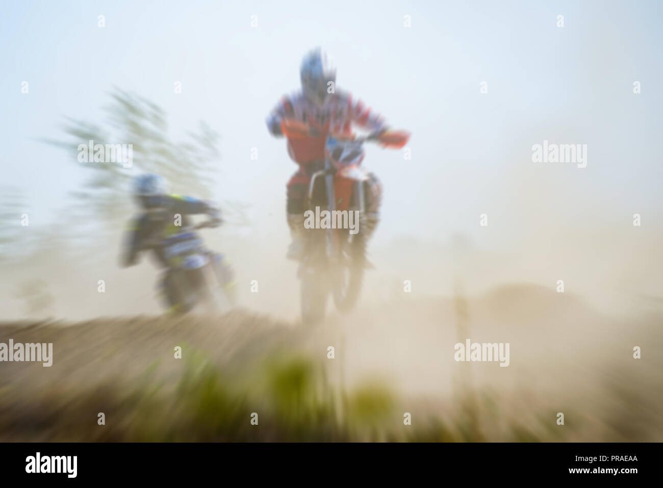Blurry image of motorcycle riders during motocross race Stock Photo - Alamy