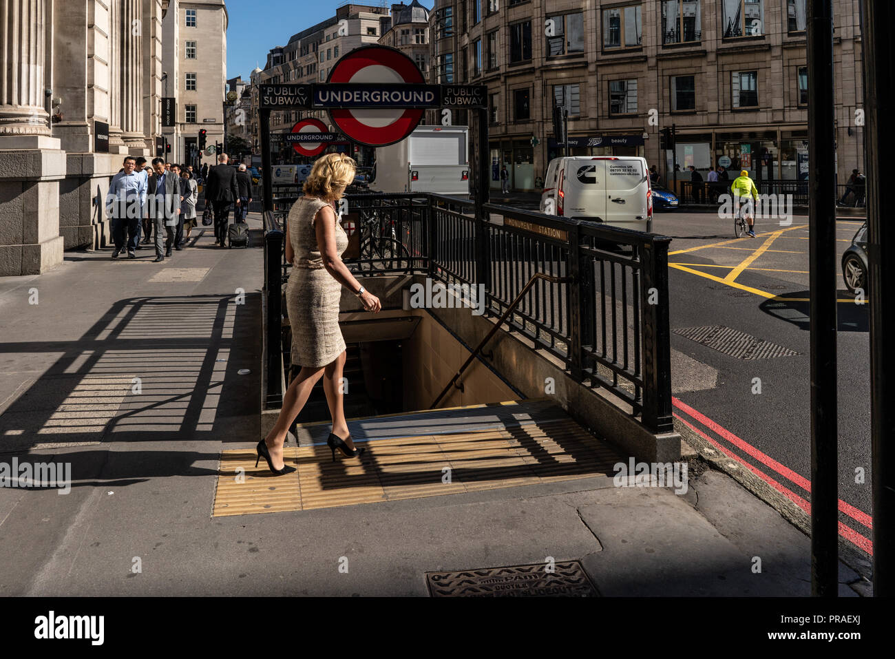 A well dressed lady in central London makes her way down the stairs ...