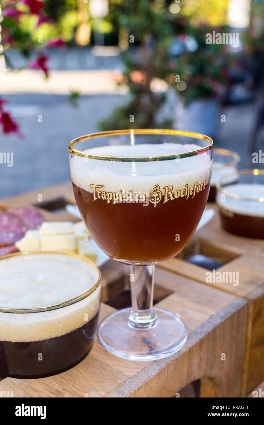 A sampling flight of Rochefort Trappist beer with a plate of local ...