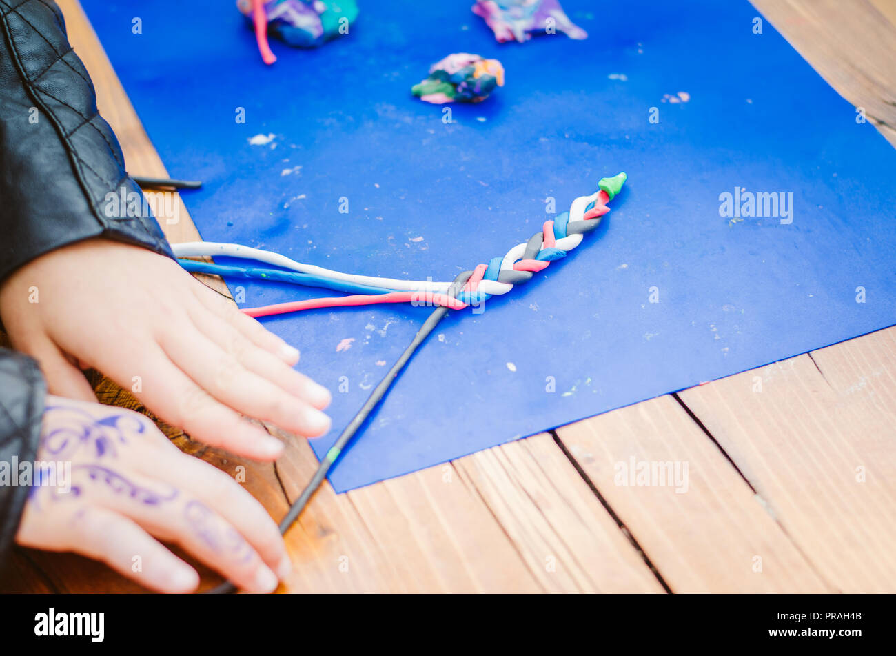 child having fun with knitting Stock Photo - Alamy