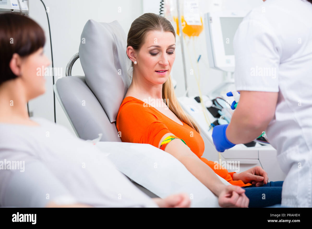 Nurse disinfecting puncture point before blood donation Stock Photo - Alamy