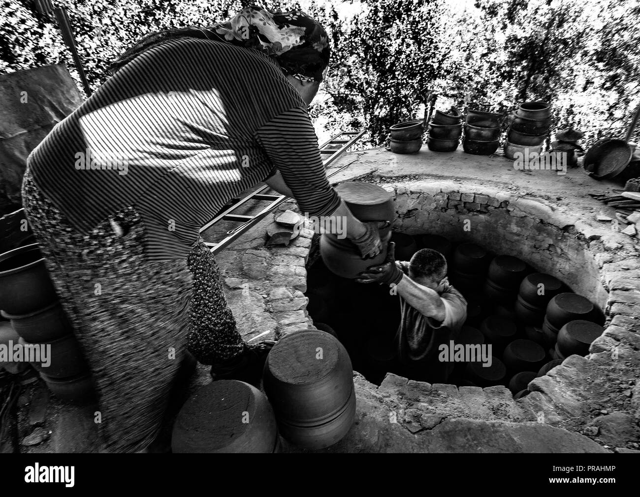 Craftsman hand making pottery Black and White Stock Photos & Images - Alamy