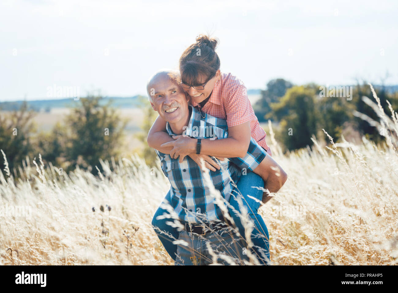 Man carrying wife on back hi-res stock photography and images - Alamy