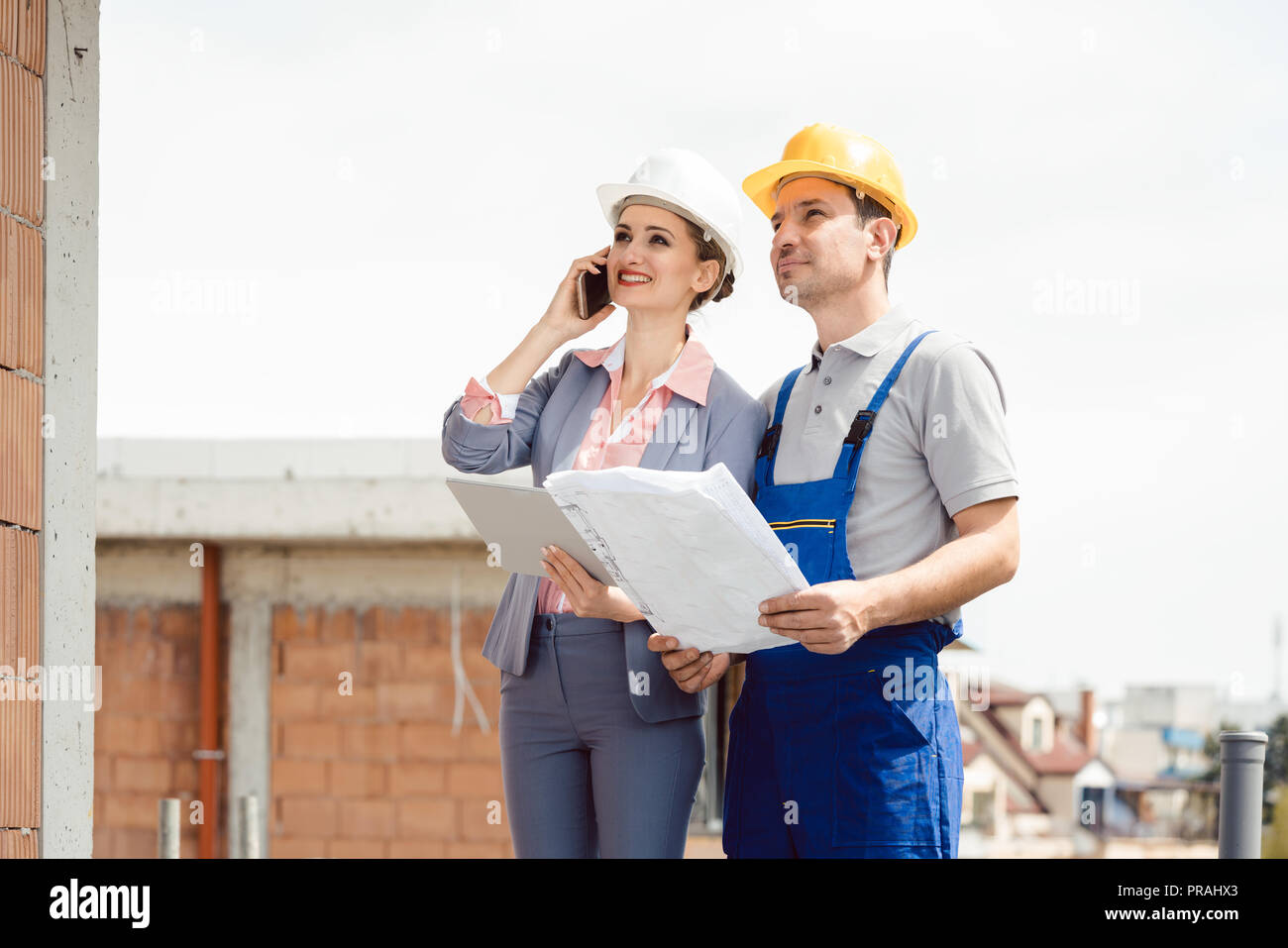 Project developer and construction worker on site Stock Photo - Alamy