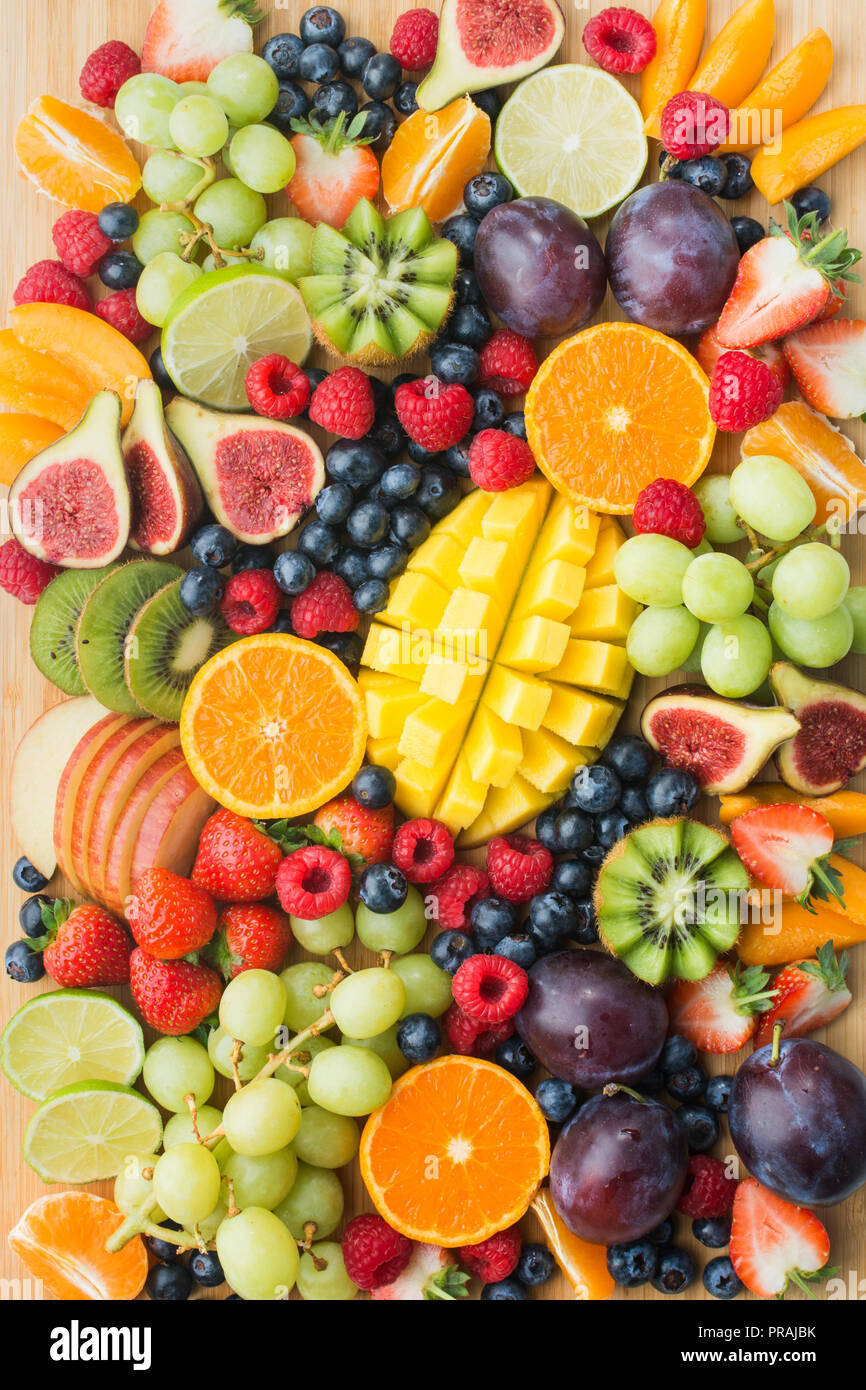 healthy raw fruits and berries platter background, strawberries ...