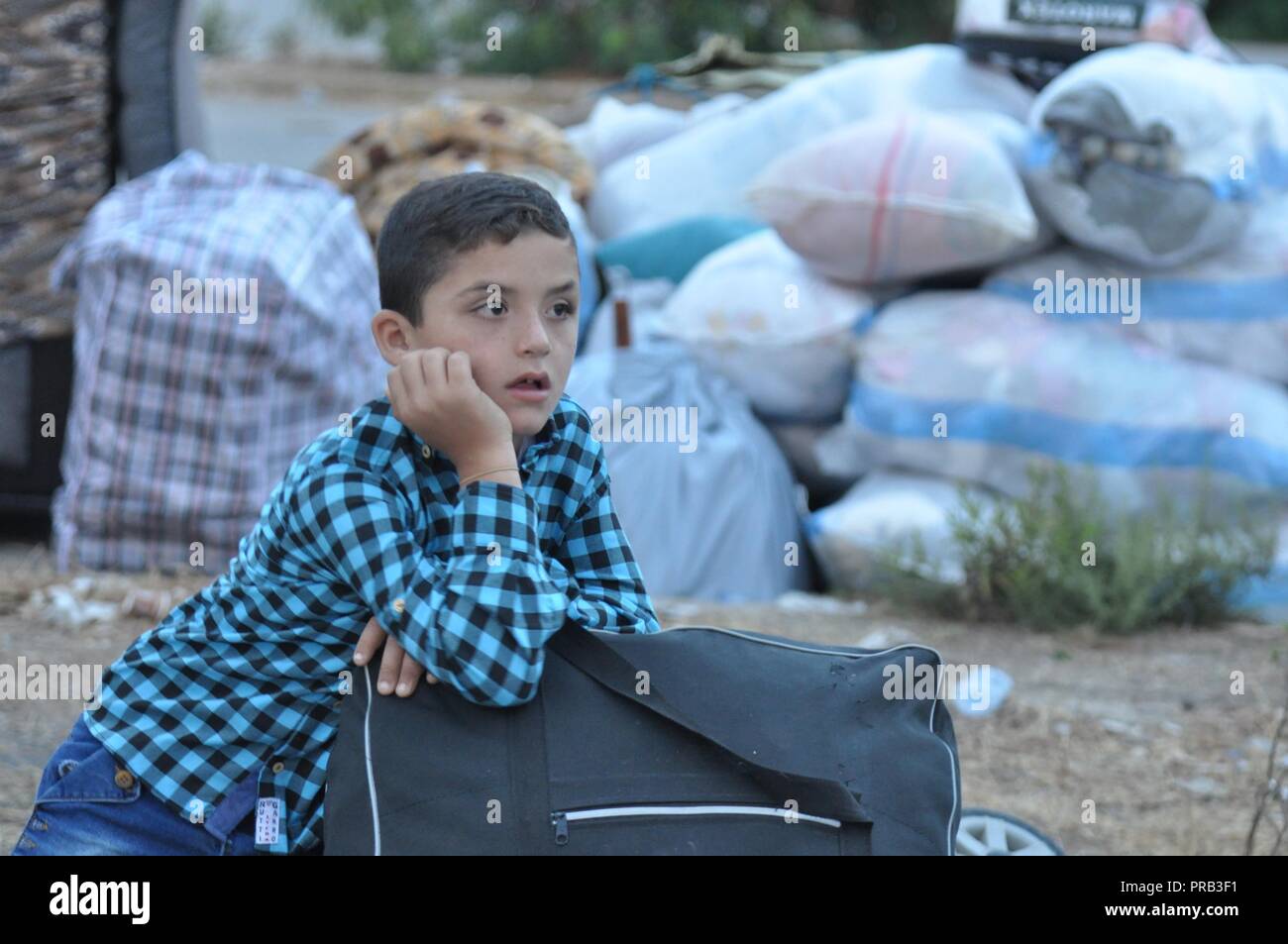 Refugee boy hi-res stock photography and images - Alamy
